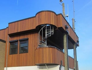 Installing a Wood Rain Screen Vertically on a Curved Wall